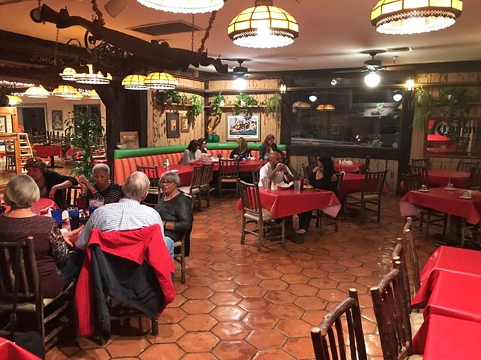 Multi-generational diners gathered around red-clothed tables&mdash;proof that good Mexican food brings families together better than any reunion.