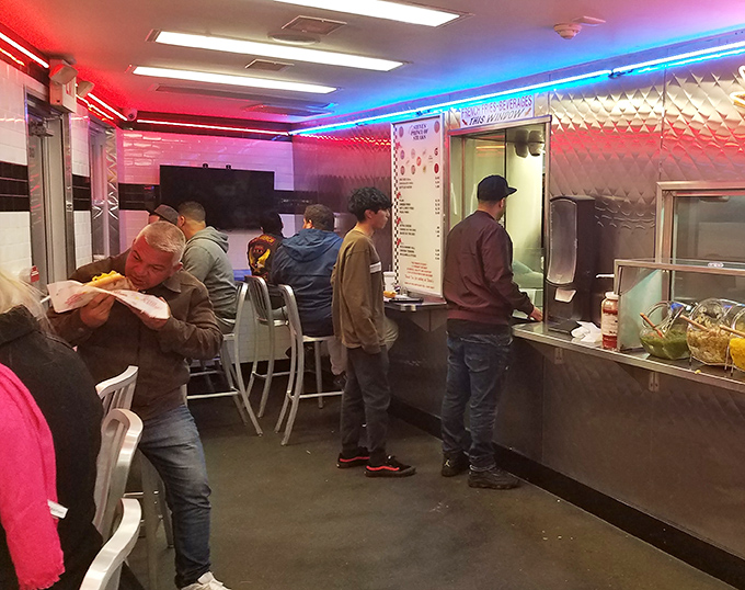The lunch rush ballet&mdash;customers lined up, hunched over counters, lost in the meditative act of serious sandwich consumption. A beautiful Philadelphia ritual.