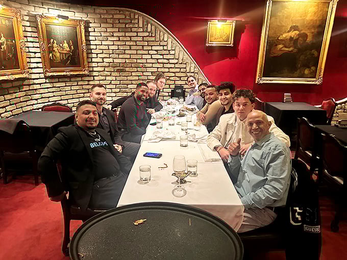 Great meals create great memories. This gathering of friends around a white tablecloth represents what dining out is truly about&mdash;connection and celebration.
