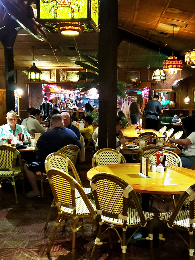 Fellow diners gather around tables, sharing stories and exceptional beef in this convivial steakhouse atmosphere.