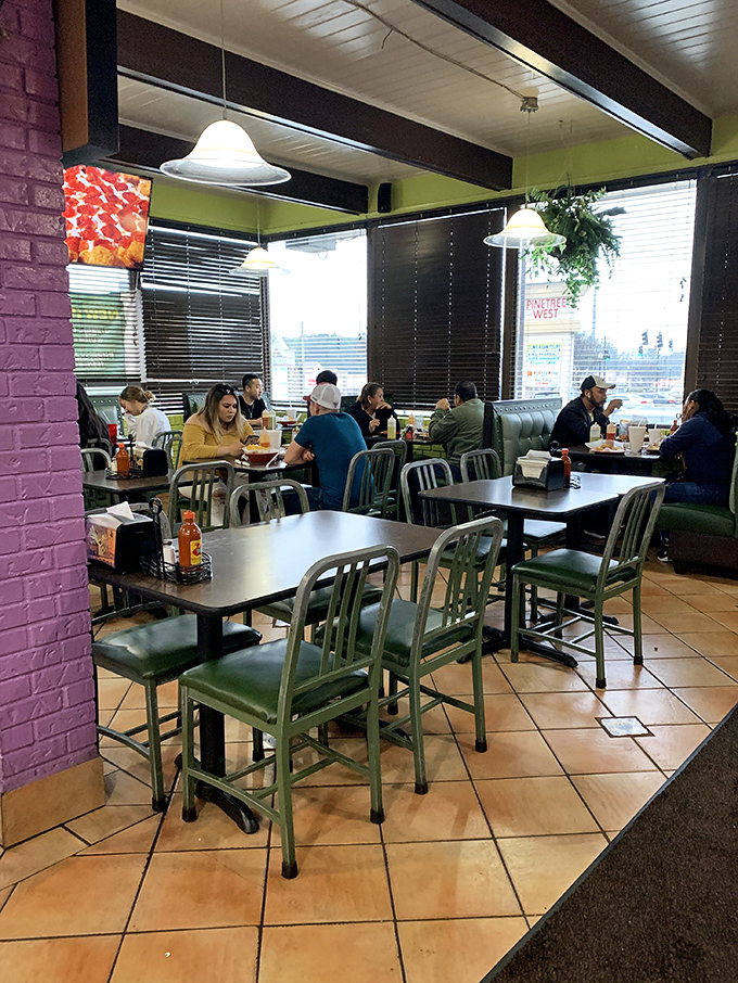 The dining room hums with the universal language of good food. Notice how nobody's looking at their phones? That's the power of proper tacos.