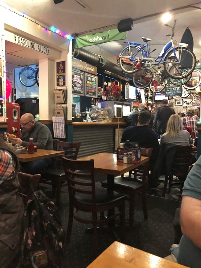 The bustling interior where strangers become friends over shared food appreciation. Notice the bicycles overhead watching the delicious proceedings below.
