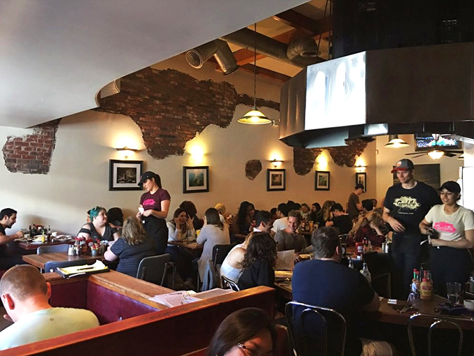 Peak breakfast hour transforms this place into a delicious battlefield where forks become weapons of mass consumption.