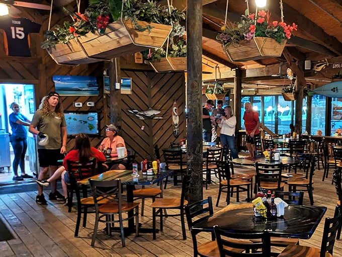 Where memories are made between bites. The hanging planters add a touch of whimsy to serious seafood business below.