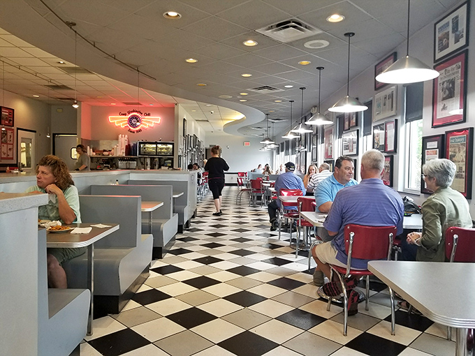 A cross-section of Cincinnati life gathers at these tables—suits next to work boots, all united by their devotion to the city's signature dish.