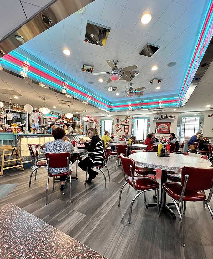Where strangers become neighbors over plates of comfort food. Notice how nobody's looking at their phones? That's the magic of a real diner experience.