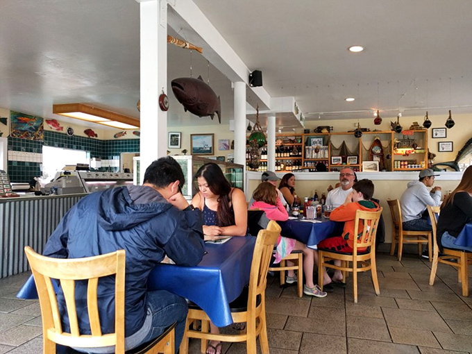 Where locals and visitors unite in the universal language of "mmm." Blue tablecloths: the great seafood equalizer.