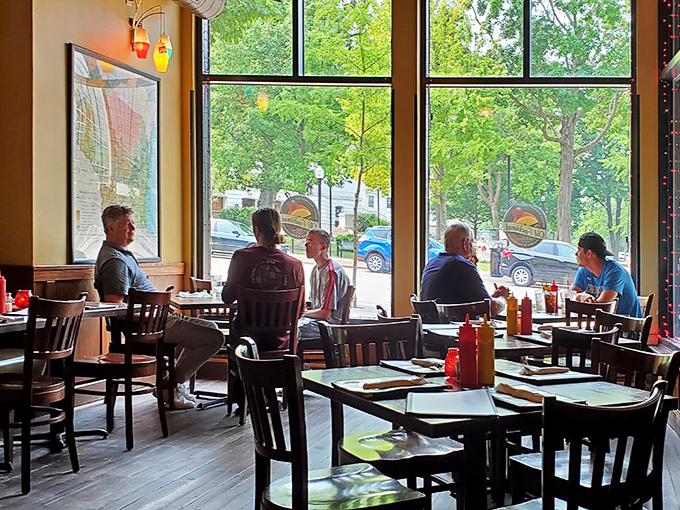 Window seats offer prime people-watching along with your comfort food, proving that sometimes the best appetizer is a slice of daily Madison life.