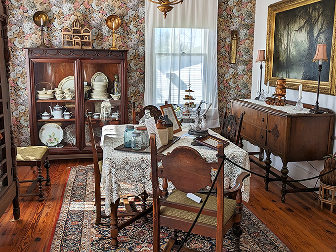The dining room's floral wallpaper and formal place settings await phantom diners. I half-expected to see steam rising from those empty serving dishes.
