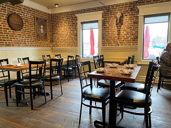 A dining room where memories are made between bites. The brick walls have likely witnessed countless "Oh my God, you have to try this" moments.