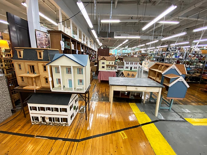 Miniature mansions awaiting tiny occupants. These dollhouses represent more craftsmanship than many full-sized homes built today.