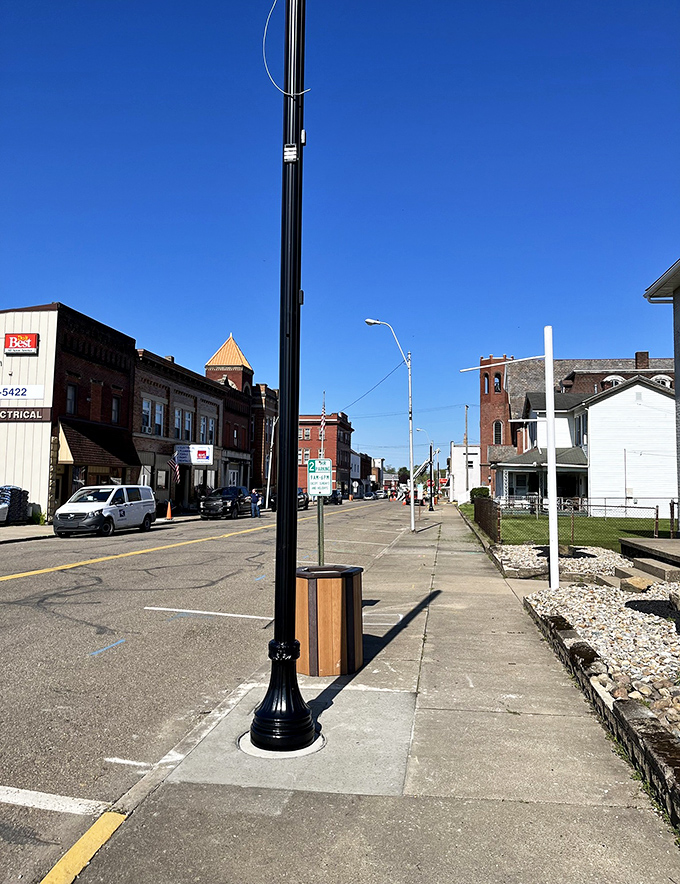 Downtown Dennison's streetscape reveals the architectural bones of a classic American main street, where brick buildings have witnessed over a century of daily life.