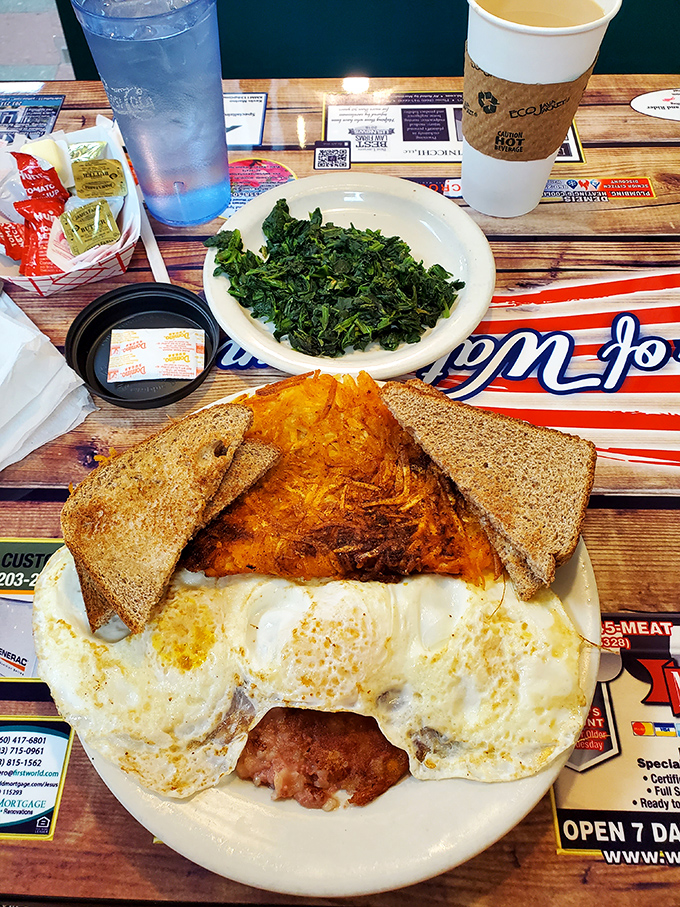 Breakfast of champions: eggs sunny-side up with a side of greens. The toast stands by, ready for its supporting role.