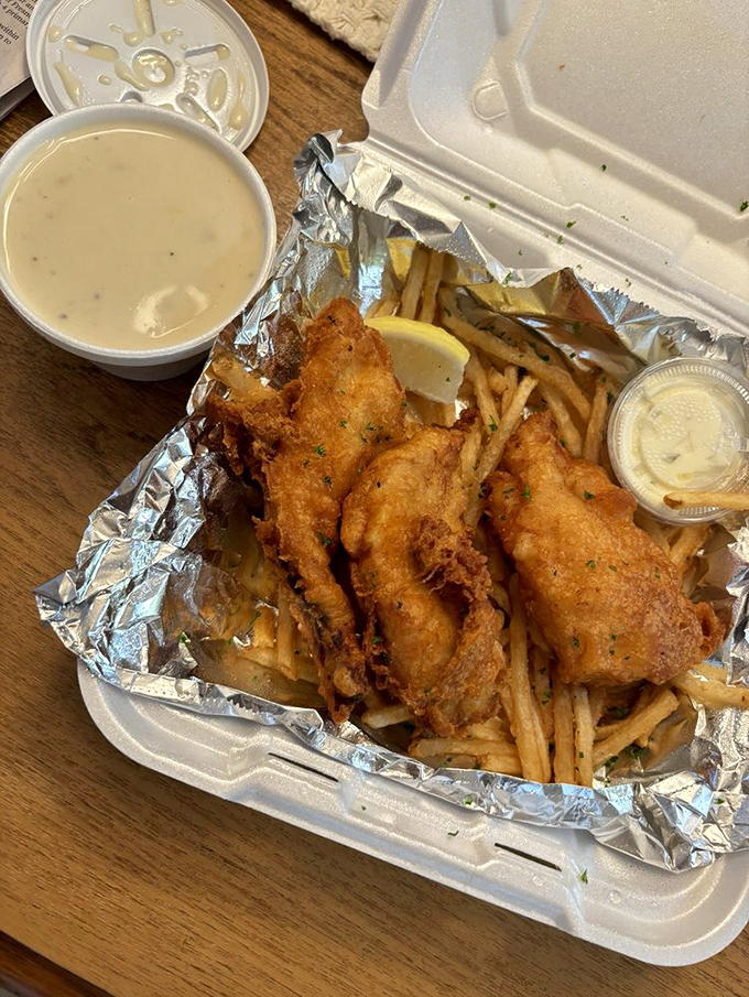 Fish and chips that would make the British weep with joy, nestled in foil like the treasure it truly is.