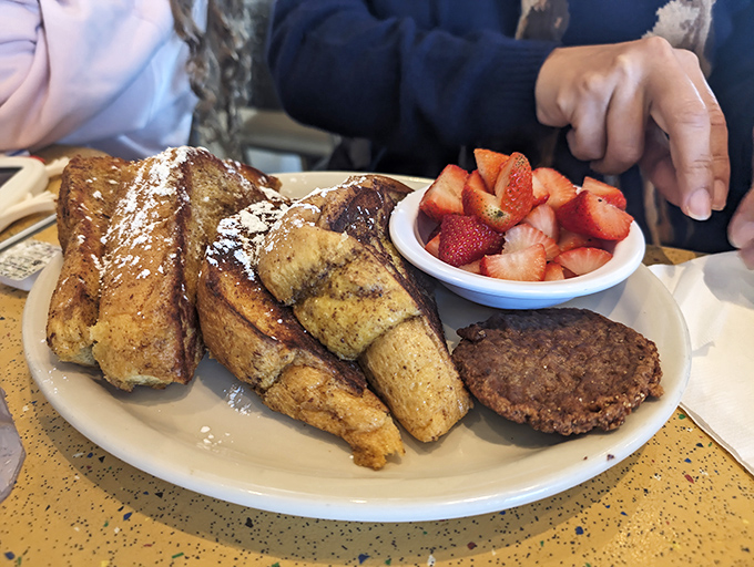 French toast that's dressed for success with powdered sugar and real maple syrup&mdash;comfort food that's not afraid to show off a little.