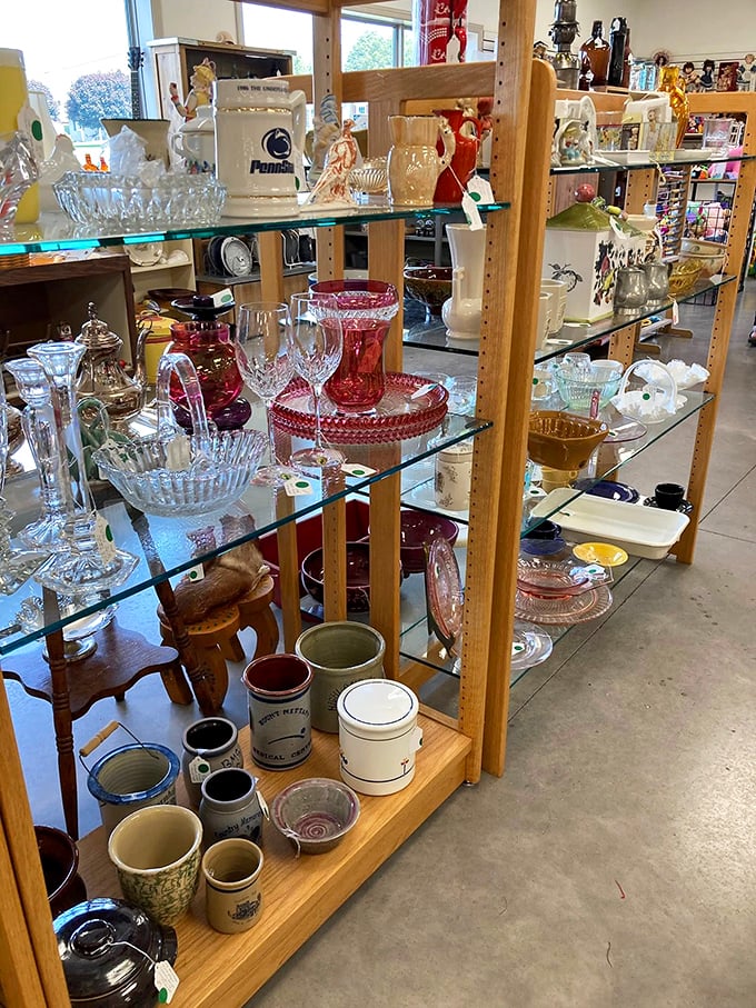 Crystal and glassware gleam under fluorescent lights, waiting to elevate your next dinner party from casual to "where did you find these?"