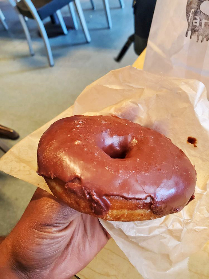 The chocolate glaze has that mirror-like shine usually reserved for magazine covers. Fingerprints have never been left on something more deserving.