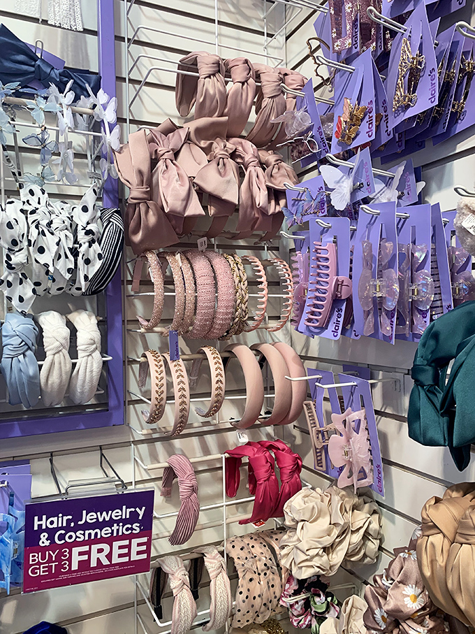A candy store for accessory lovers where hair bows and headbands create a pastel landscape of possibilities, complete with buy-three-get-three deals.