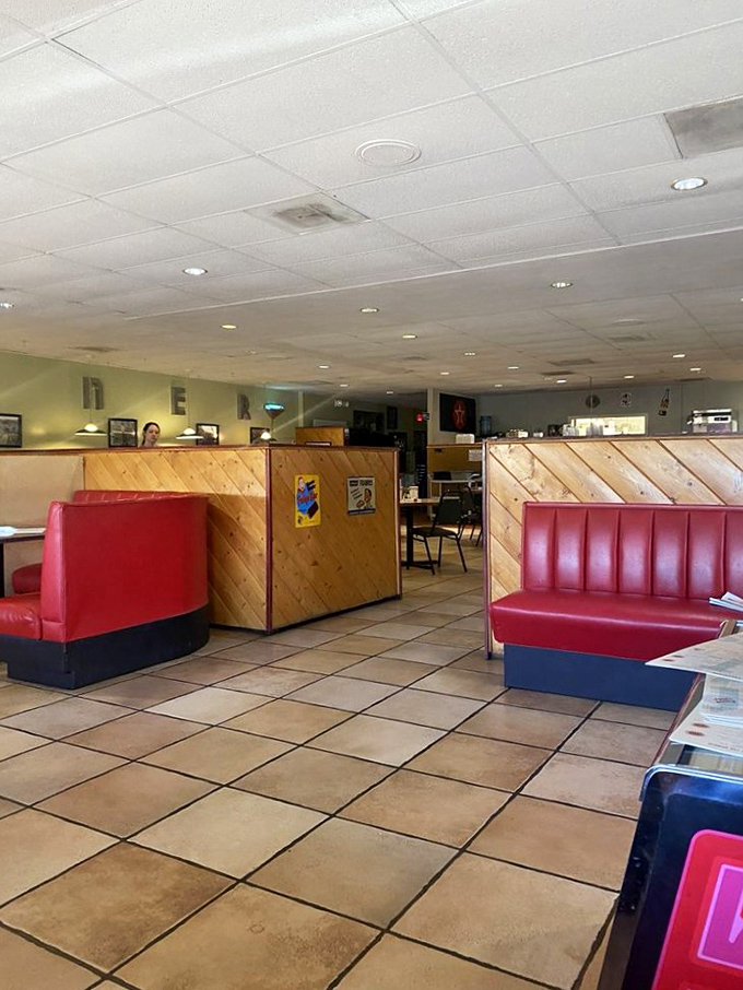 Red booths and tile floors create that authentic diner atmosphere where every meal feels like home. 
