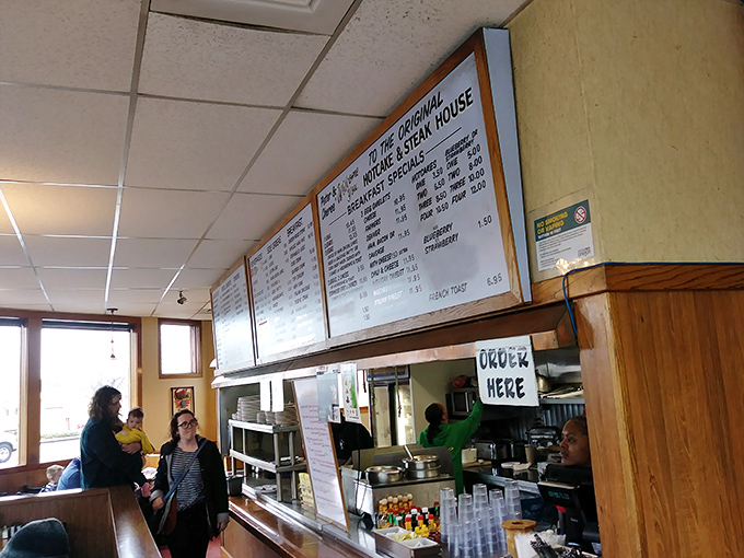 The ordering counter—where dreams begin and hunger ends. Follow the instructions and culinary happiness awaits.