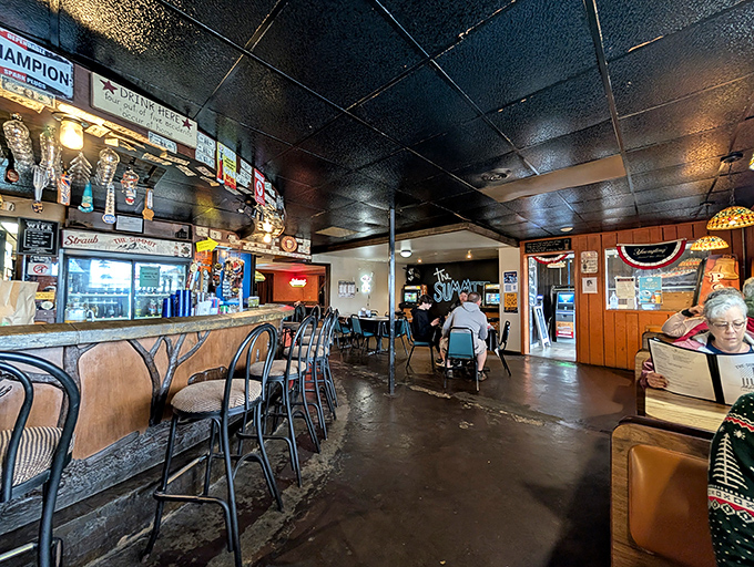 Where locals gather and visitors become regulars. The bar area hums with conversation while cold drinks flow and memories are made.