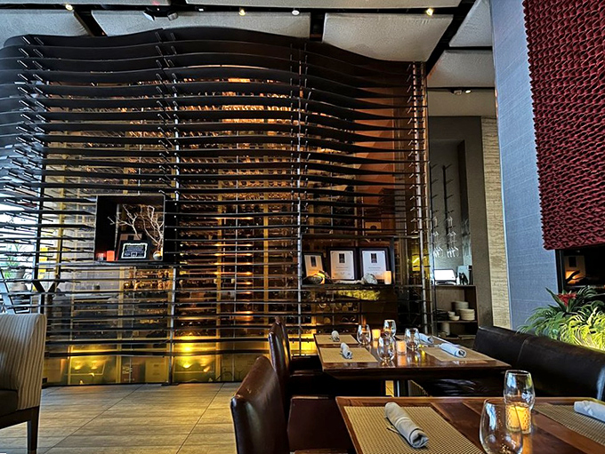 Sleek wooden slats and warm lighting create intimate dining zones, proving BOA understands ambiance is as important as what's on your plate.