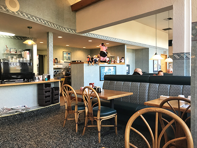 Booth seating that invites you to settle in for the long haul. Notice the pig figurines watching over diners like breakfast guardian angels.