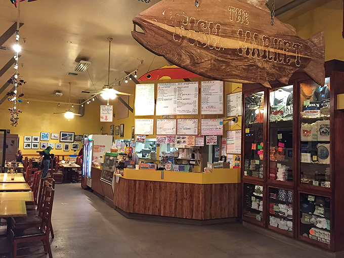 Inside Phil's, the wooden fish suspended from the ceiling isn't just decor&mdash;it's a silent guardian watching over the culinary magic happening below.