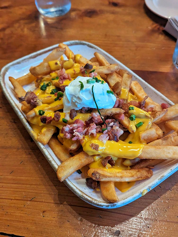 Loaded fries that make French cuisine seem unnecessarily complicated. Cheese, bacon, and sour cream&mdash;the holy trinity of comfort food.
