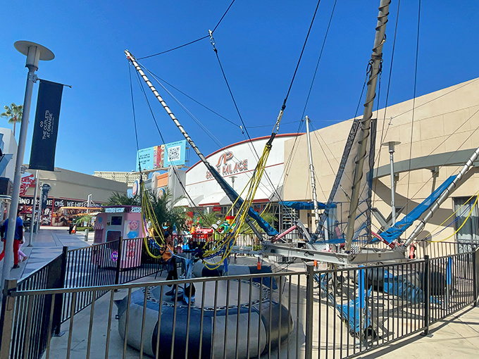 Bungee trampolines let kids bounce off their energy while parents plan their next retail conquest. 