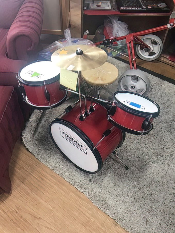 A pint-sized drum kit awaits its next rock star. Some parent somewhere is grateful this noise machine has found a new home.