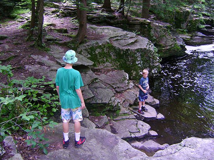 Nature's playground invites exploration at every turn. These rocky outcrops have hosted generations of adventurous kids testing their courage.