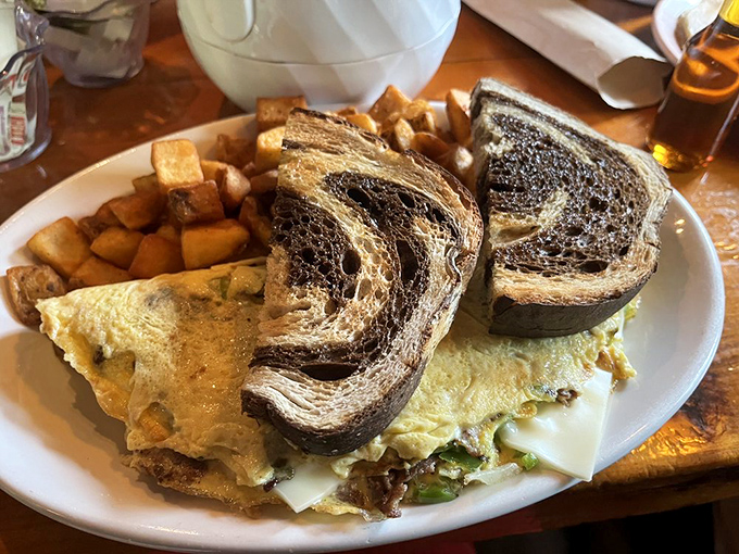 An omelet that's clearly graduated from the "bigger is better" school of New Hampshire breakfast philosophy.