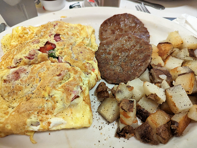 When an omelet meets a sausage patty, magic happens &ndash; especially when both are cooked on a well-seasoned flat-top that's seen decades of breakfast service.