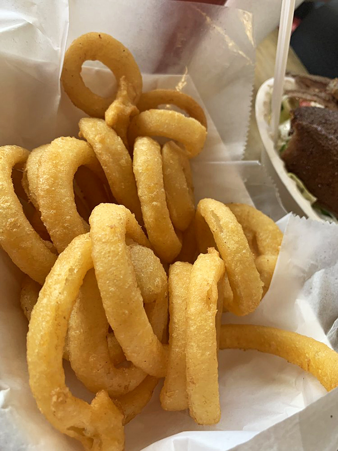 These golden halos of happiness aren't just onion rings&mdash;they're crunchy, savory treasures that make you temporarily forget about the beach outside.