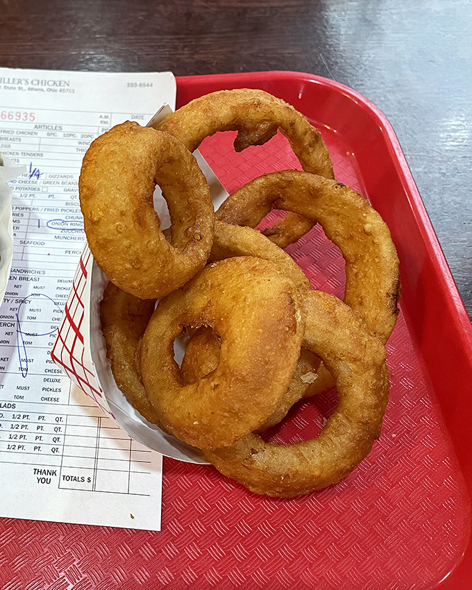 Onion rings with the structural integrity of Olympic gymnastics&mdash;crispy, golden hoops that somehow manage to be both delicate and substantial.