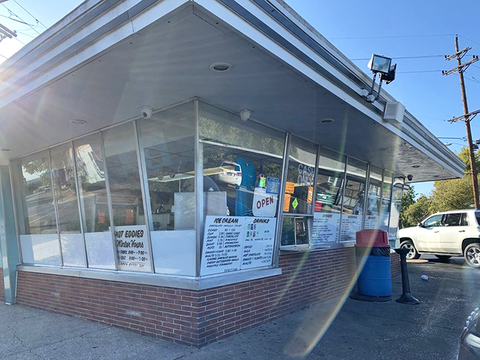 The walk-up window at Fast Eddie's—where dreams are ordered, paid for in cash, and delivered in grease-spotted paper bags of joy.