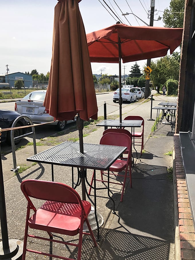 Seattle sunshine is optional, but these cheerful red tables offer the perfect outdoor spot to recover between spicy bites.