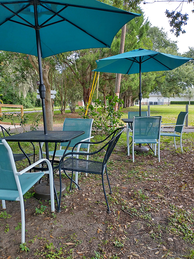 Turquoise umbrellas create breakfast oases in the Florida sunshine. This outdoor seating area whispers "take your time" in the most convincing way.