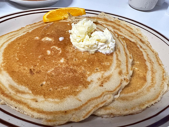 Pancakes so perfectly golden and fluffy they look like they're auditioning for a breakfast commercial. Spoiler alert: they got the part.