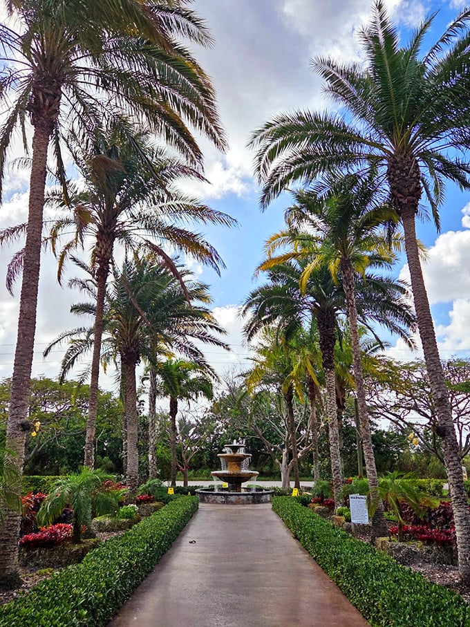 Royal palms stand sentinel along manicured pathways, leading to a fountain that would make Roman emperors nod in approval.