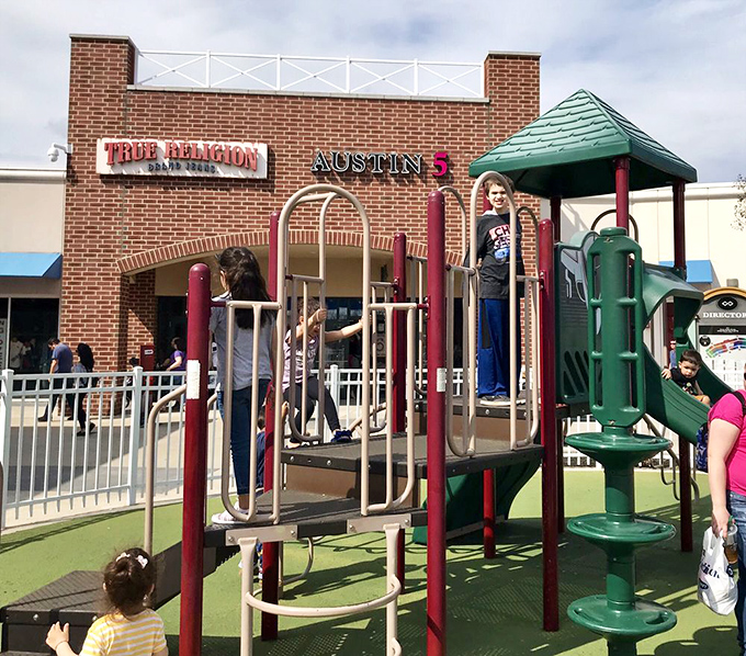 Smart outlet planning 101: Install a playground where kids can burn energy while parents debate whether they really need another pair of jeans.