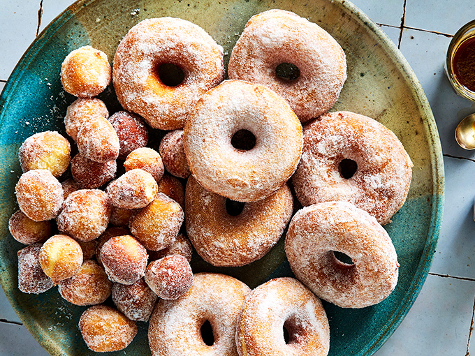 Sugar-dusted donuts and donut holes arranged like edible art&mdash;the kind of masterpiece you appreciate with your taste buds.