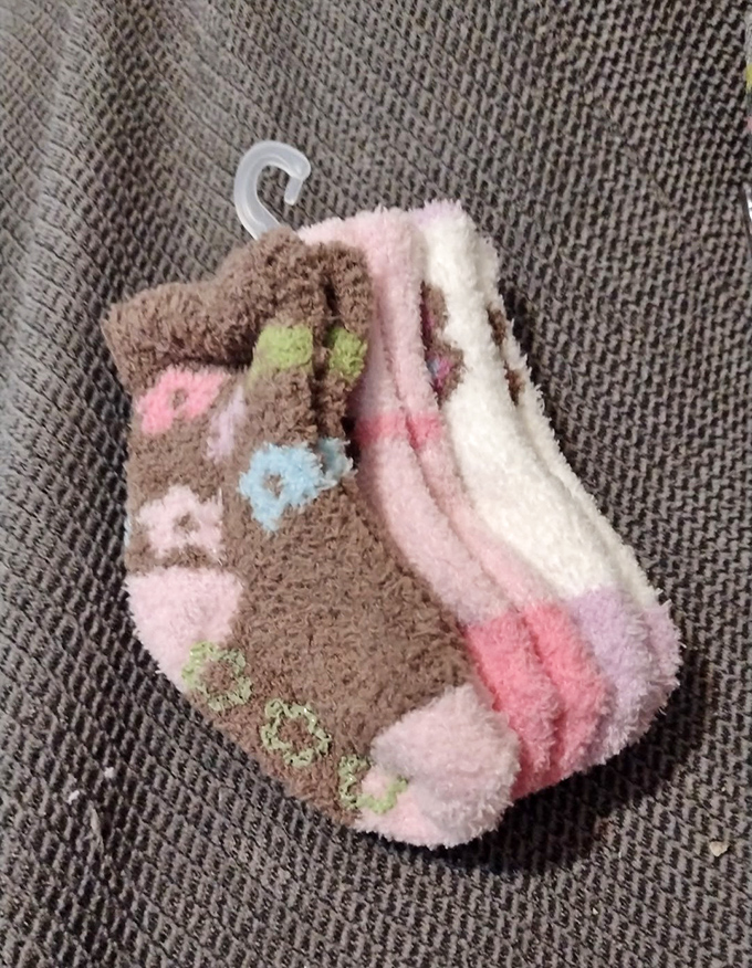 Fuzzy socks with forgotten histories hang ready for new adventures&mdash;perfectly priced for Michigan's notorious winter chill or quirky gift exchanges.