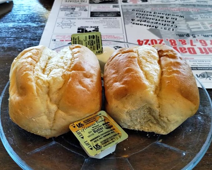 Fresh-baked rolls arrive at your table like warm, yeasty pillows, waiting for their butter blankets before disappearing into happy stomachs.