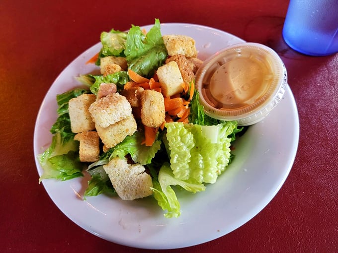 Even the salad gets respect here&mdash;crisp greens, crunchy croutons, and a dressing that doesn't apologize for being delicious. Balance, people. Balance.