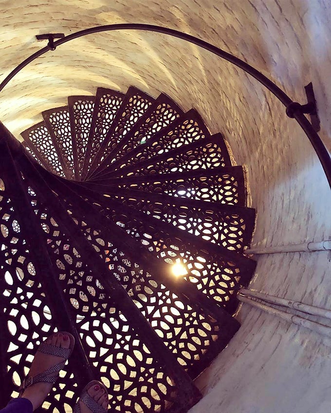 These ornate iron spiral stairs aren't just functional&mdash;they're Victorian industrial art that would make steampunk enthusiasts weak at the knees.