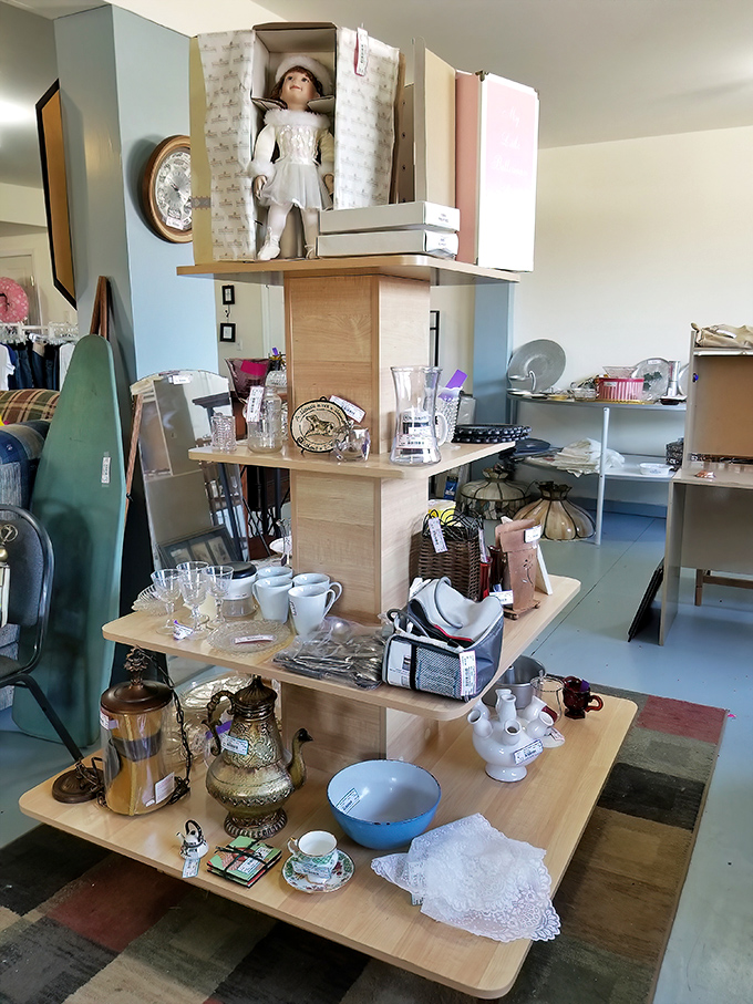 This multi-tiered display showcases everything from vintage glassware to collectible dolls&mdash;each shelf a different chapter in someone's story.