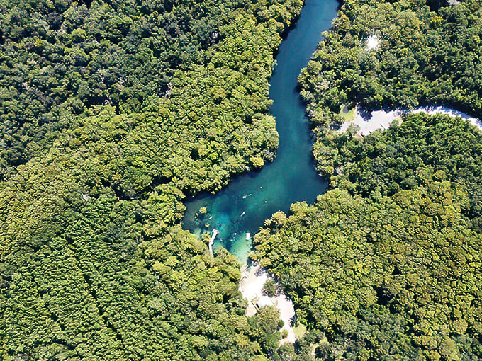 Nature's sapphire set in an emerald ring. From above, Morrison Springs looks like jewelry designed by Mother Earth herself.