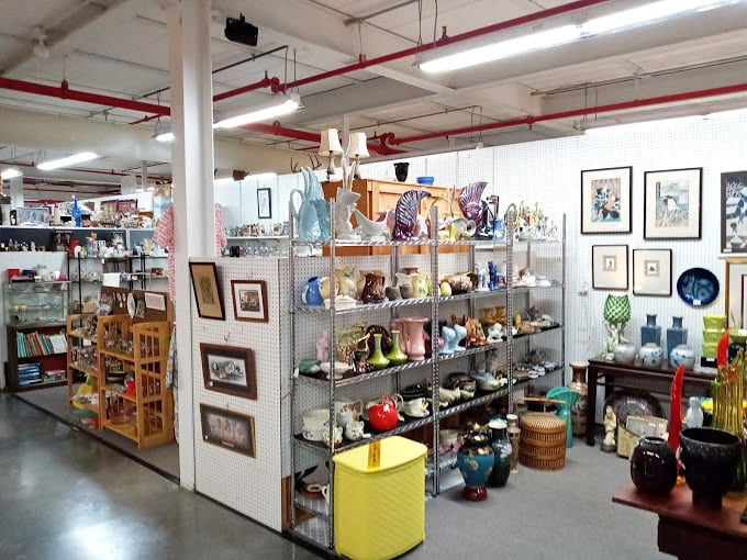 An organized chaos of pottery, glassware, and decorative items creates a treasure hunter's paradise where patience is rewarded with perfect finds.